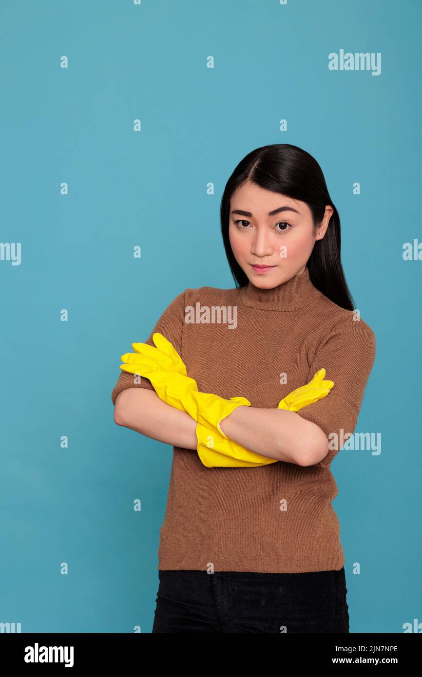 Sad unhappy and stressed asian housekeeper cross hand angry eyes with ...