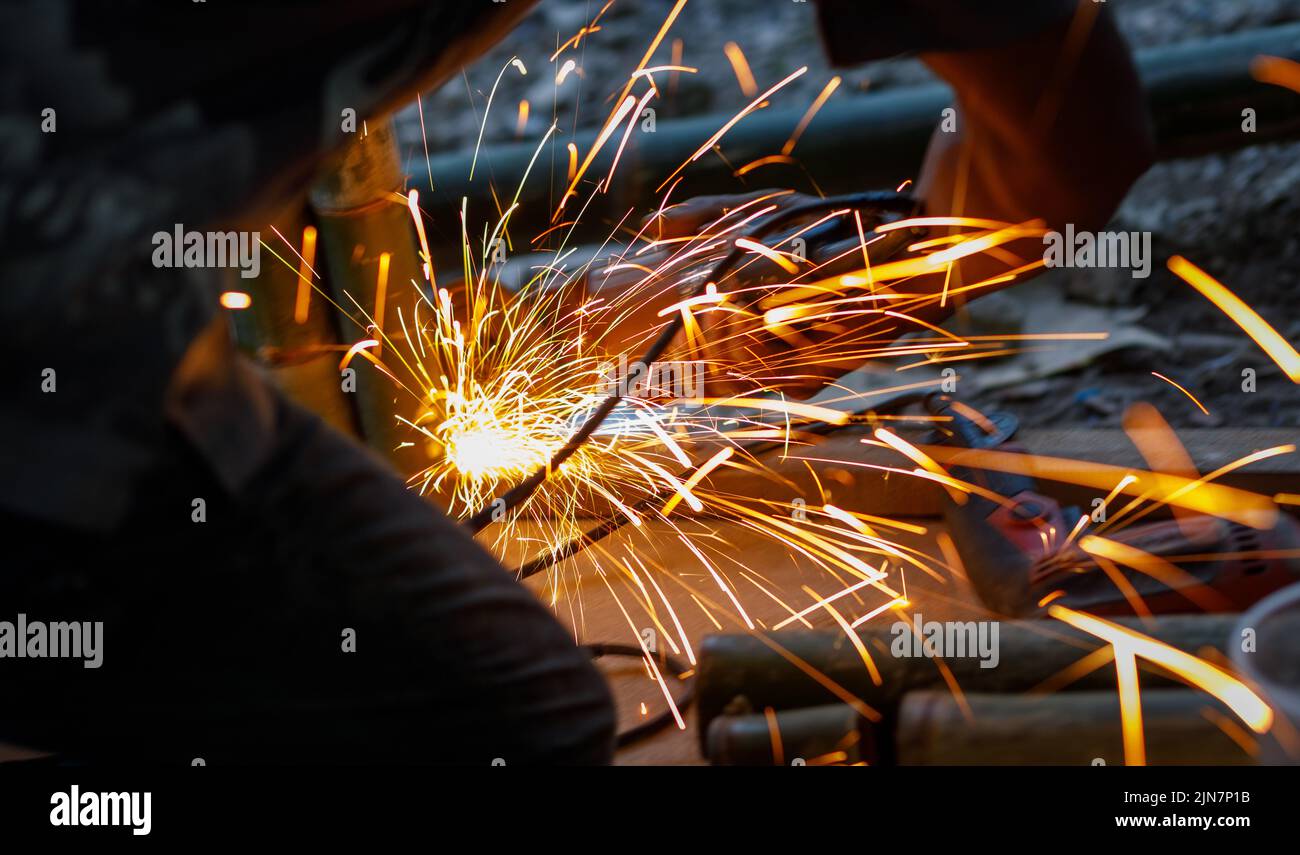 Sparks fly from industrial grinder hi-res stock photography and images ...