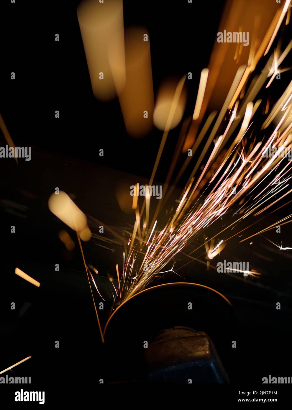Sparks fly from industrial grinder hi-res stock photography and images ...