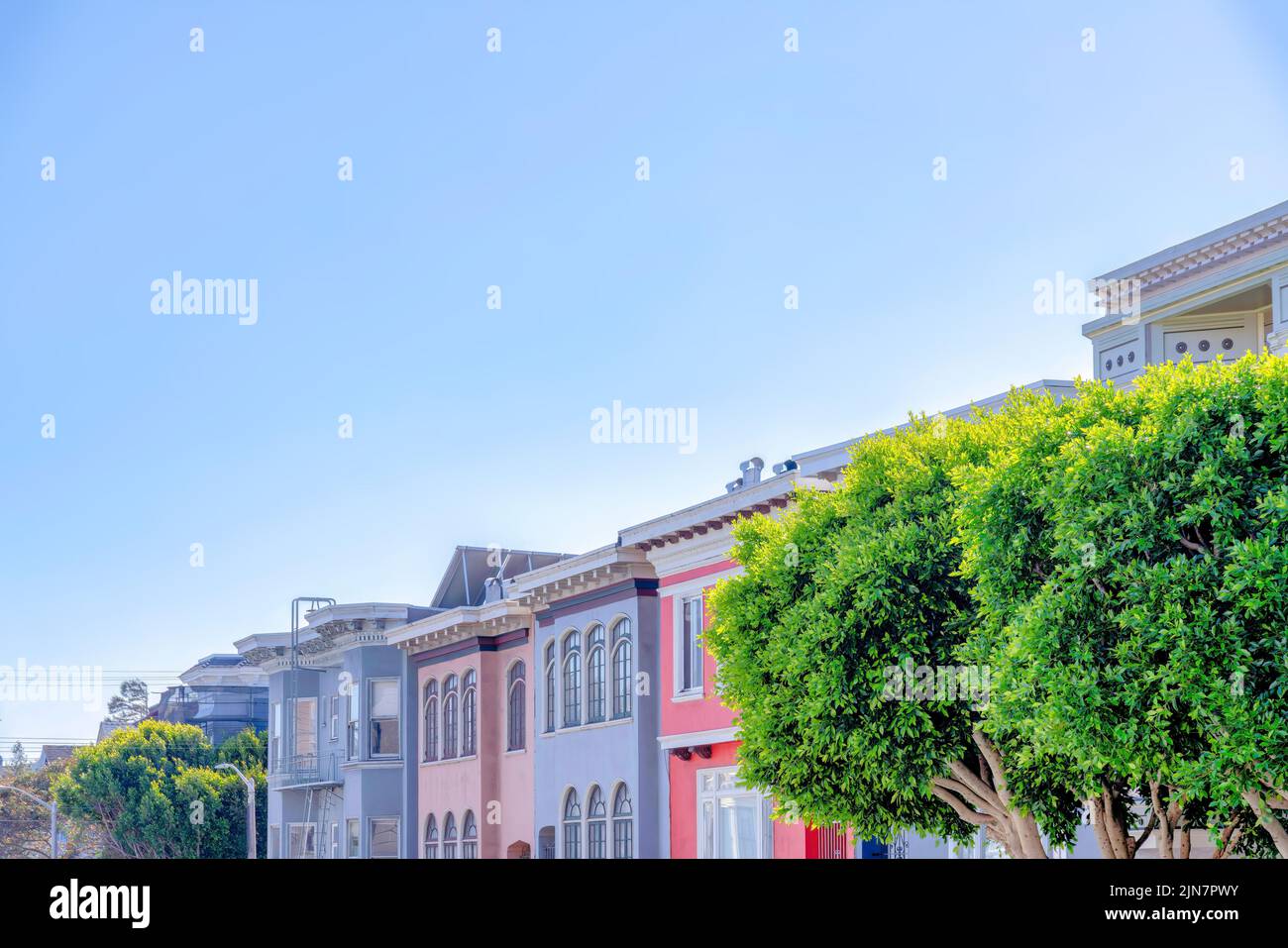 Colorful adjacent residential buildings with paned windows at San ...