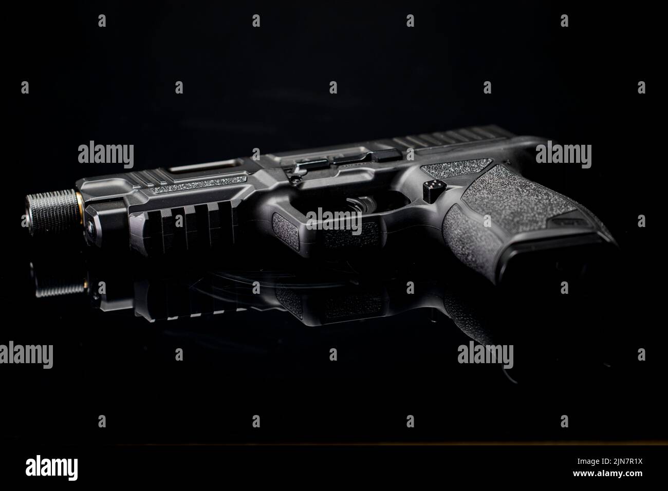Hand gun close up black firearm Stock Photo - Alamy
