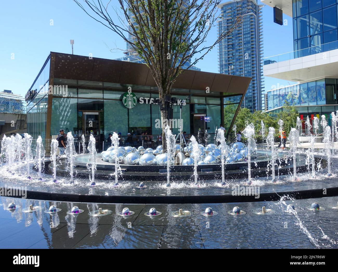 Starbucks coffee shop with outdoor water fountain in Surrey Stock Photo ...