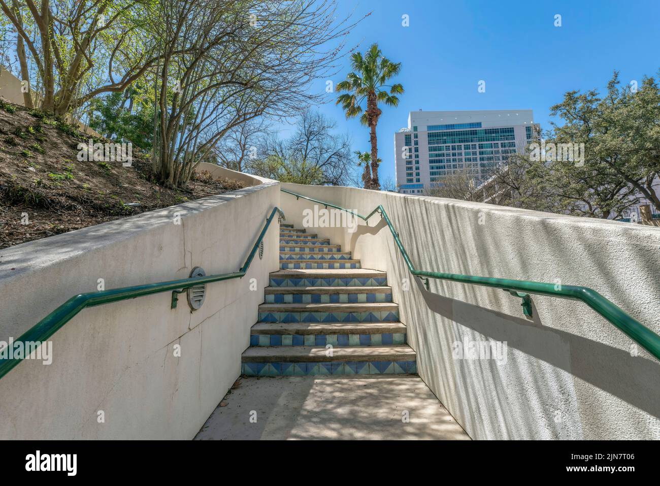 Staircase with concrete half wall and tile risers at San Antonio, Texas ...