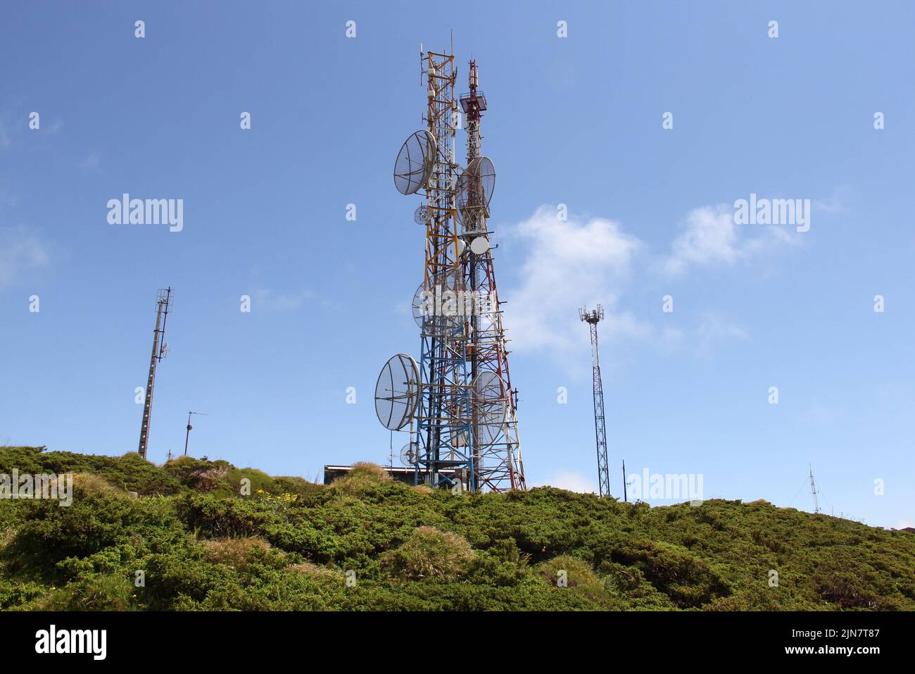 Communications antennae topping the summit of the highest mountain of ...