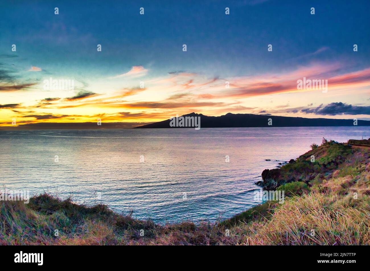 Calm sunset view at Honolua Bay out to Molokai at sunset Stock Photo ...