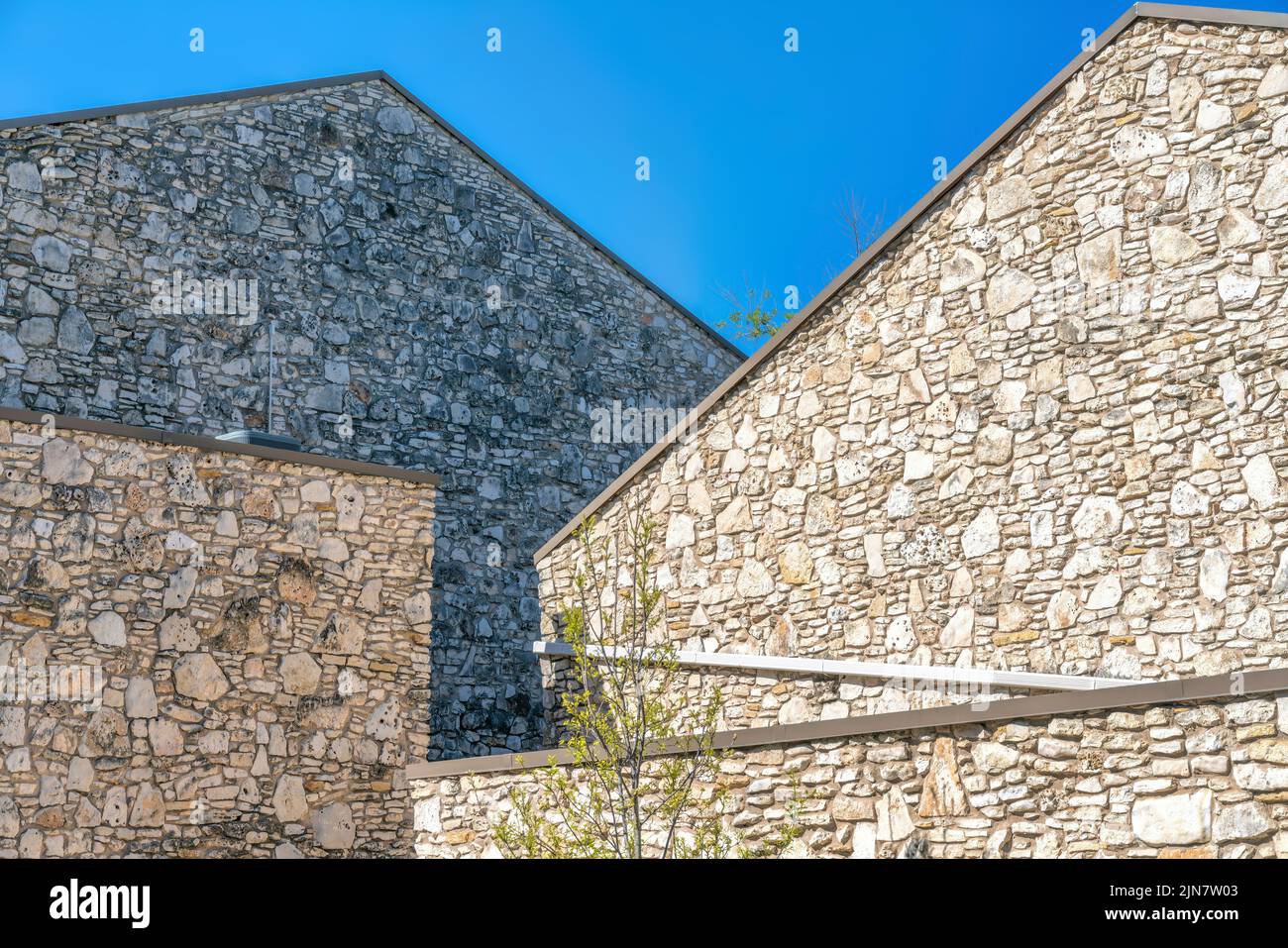 Buildings with stone wall cladding against the blue sky in Austin ...