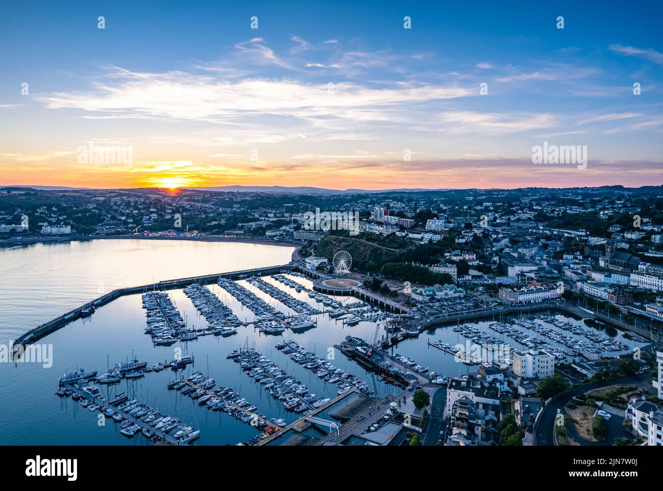 Sunset over Torquay Harbour and Marina, English Riviera from a drone ...