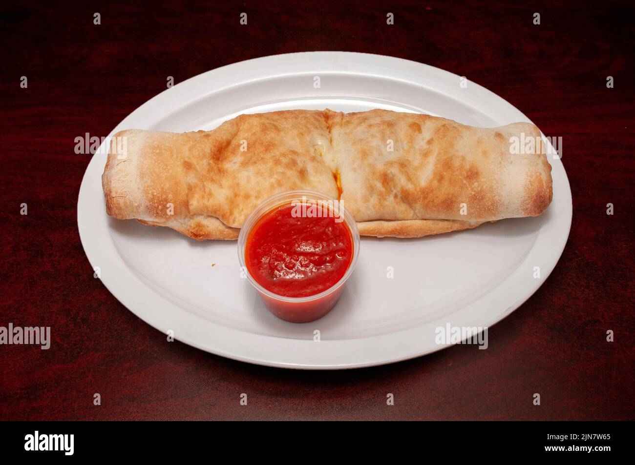 Delicious Italian dish best known as stromboli Stock Photo - Alamy