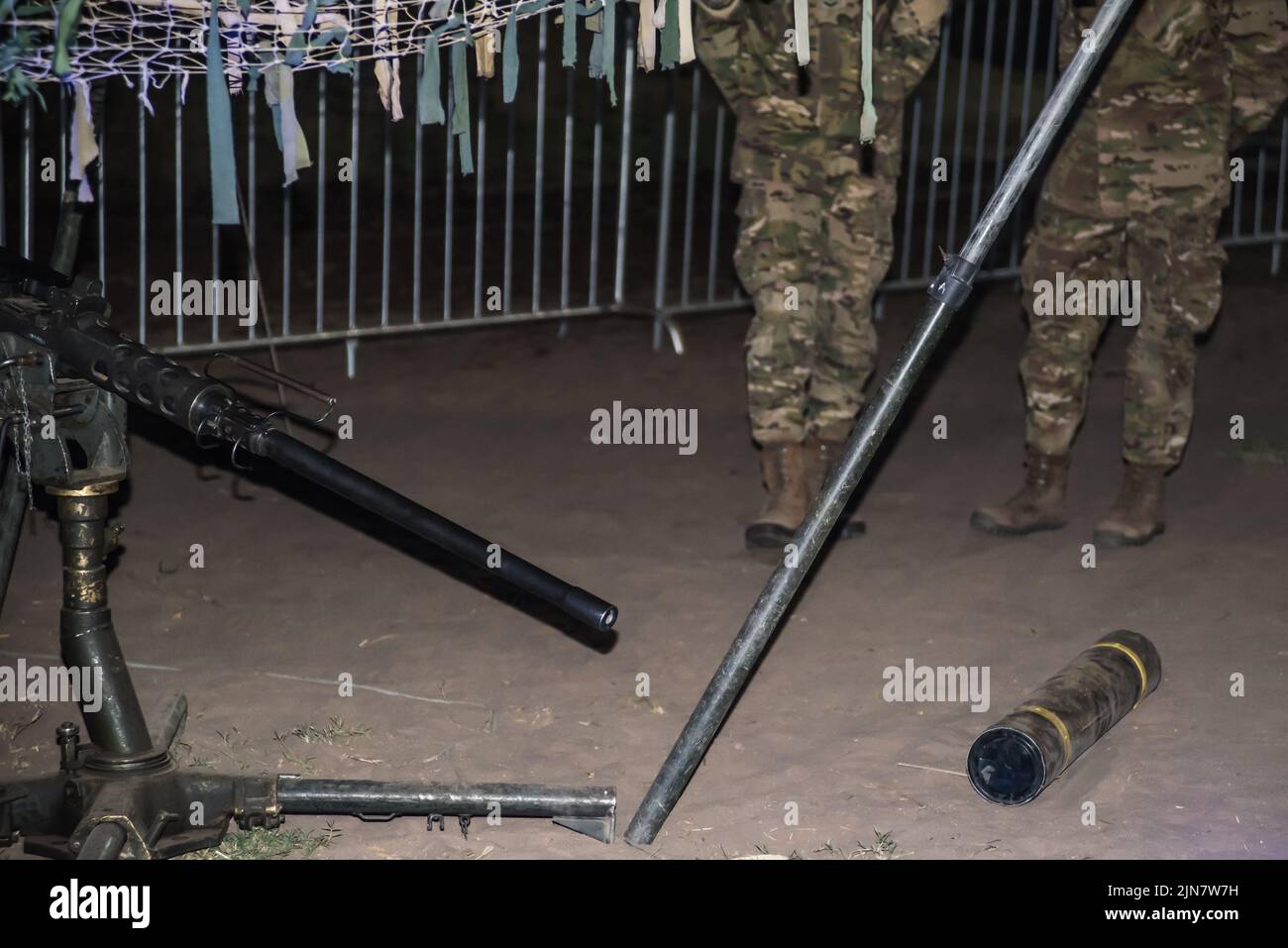The military soldiers in background of machine gun on ground Stock ...