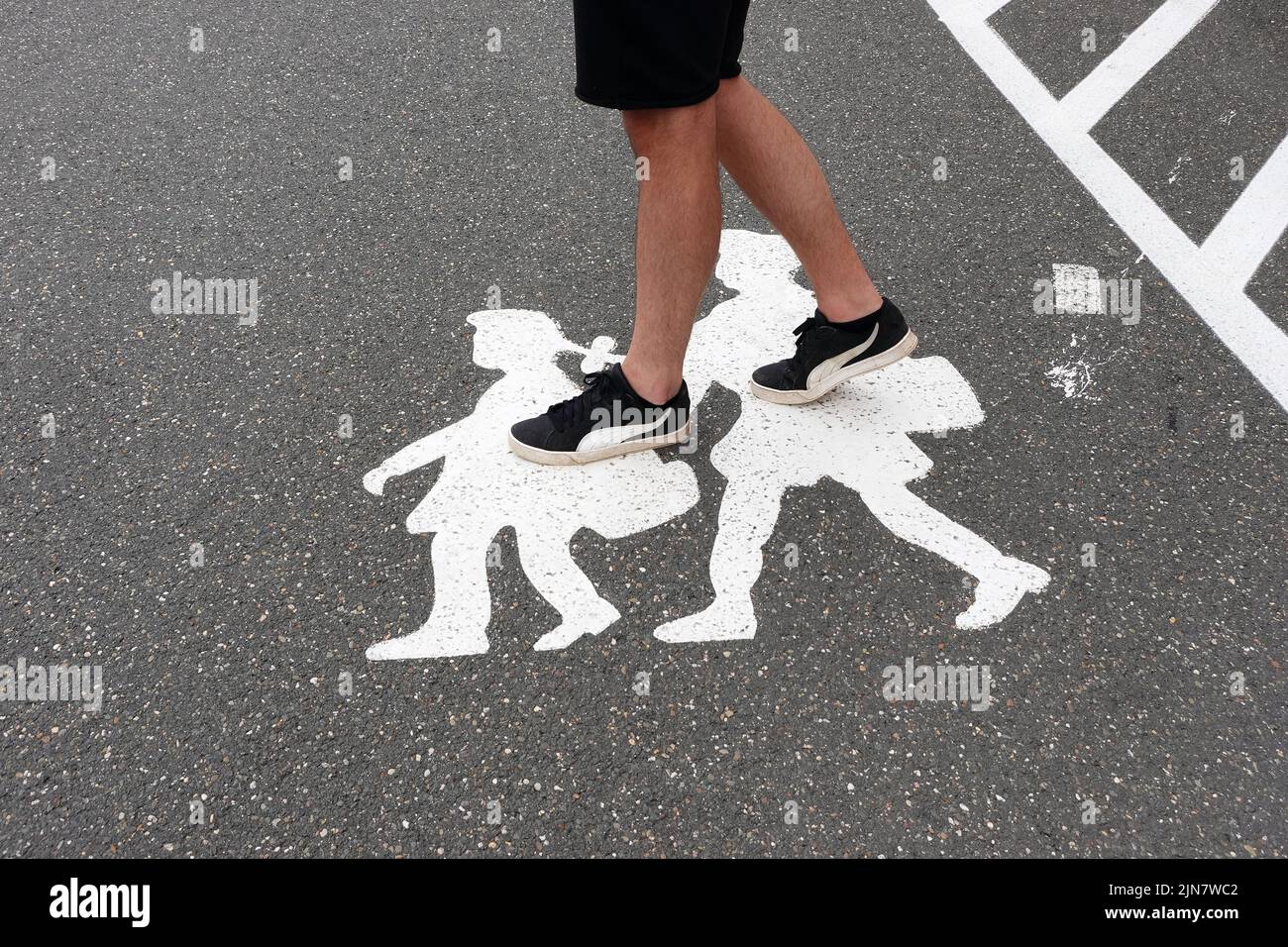 Silhouette of children painted on an asphalt road Stock Photo - Alamy