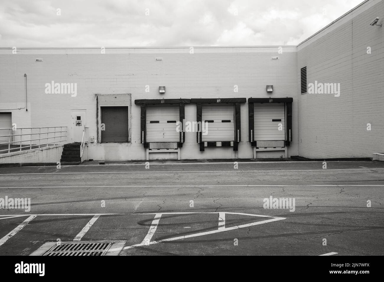 A grayscale shot of a loading dock building Stock Photo - Alamy