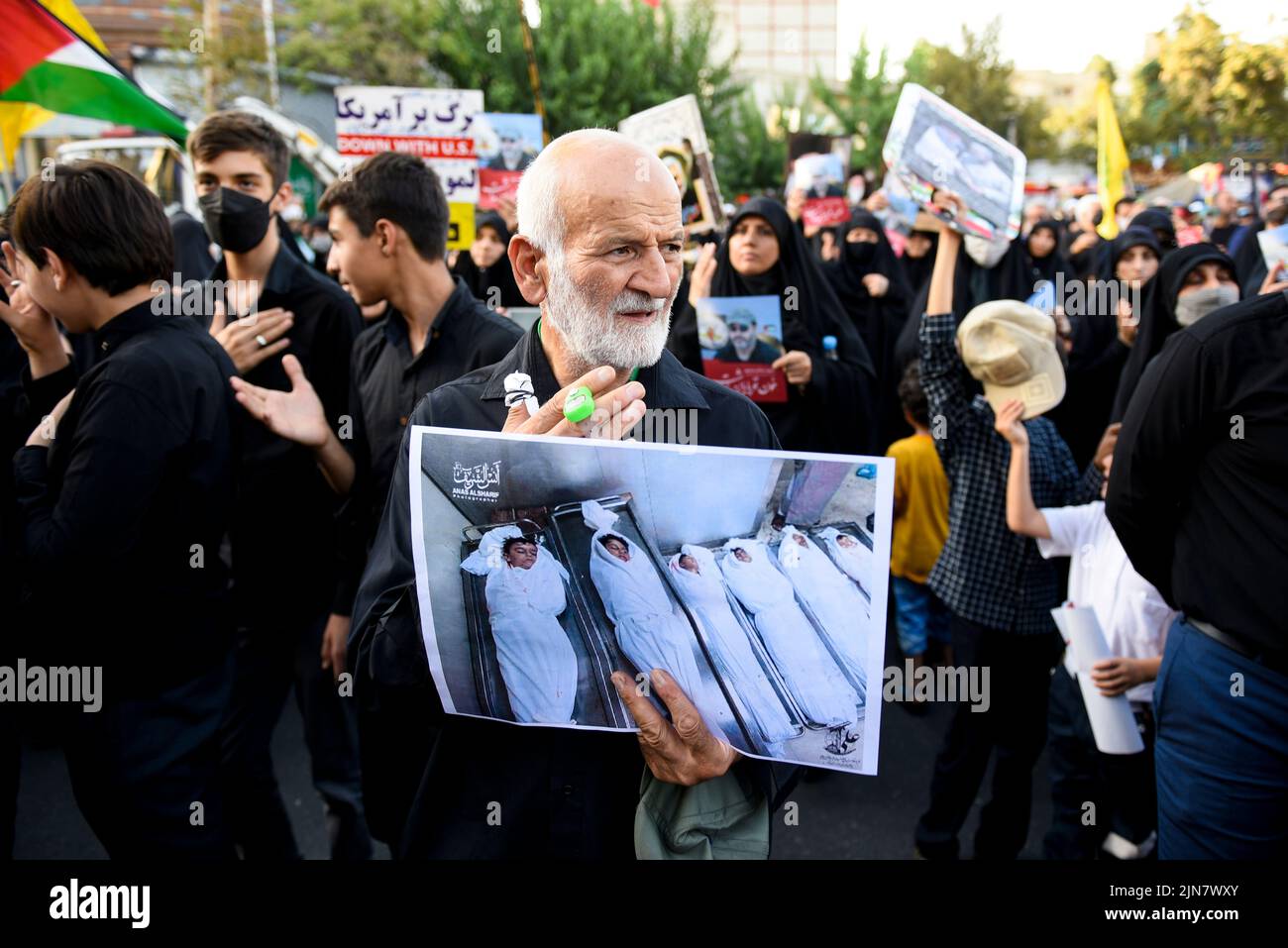 Tehran, Tehran, Iran. 9th Aug, 2022. An old man holds a poster with ...