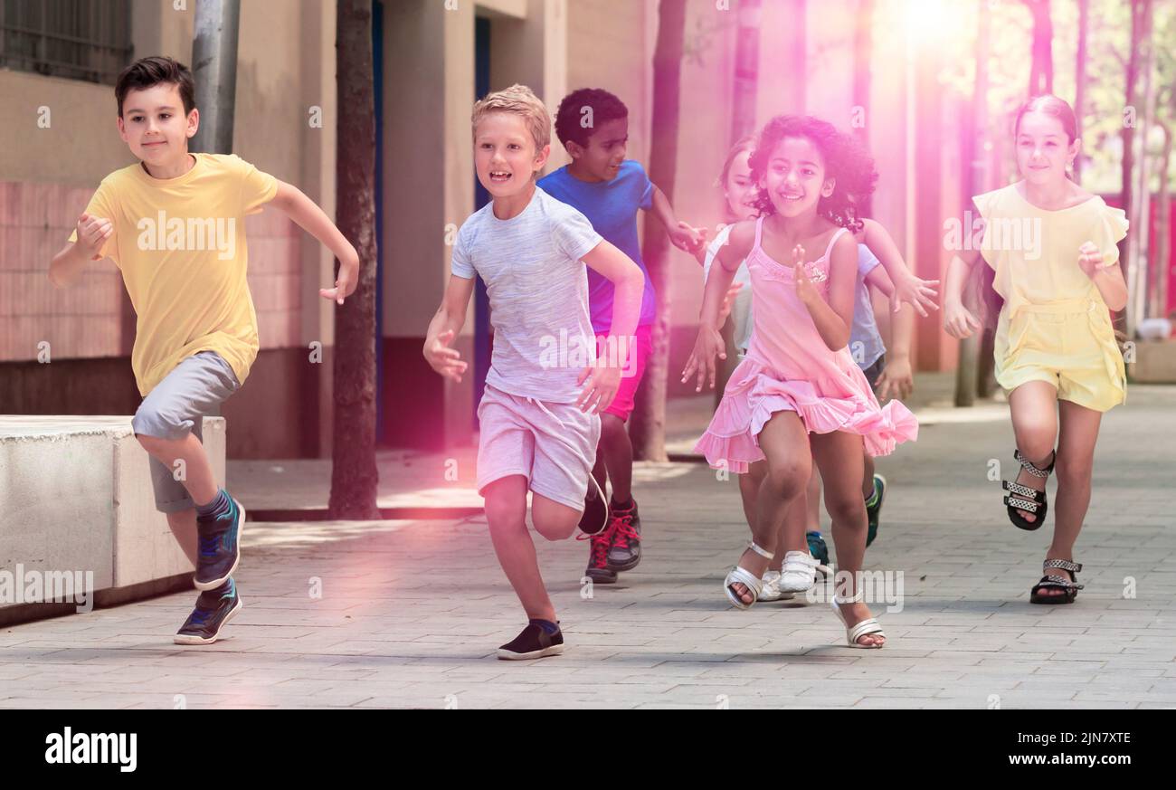 Happy children running in race and laughing outdoors Stock Photo - Alamy