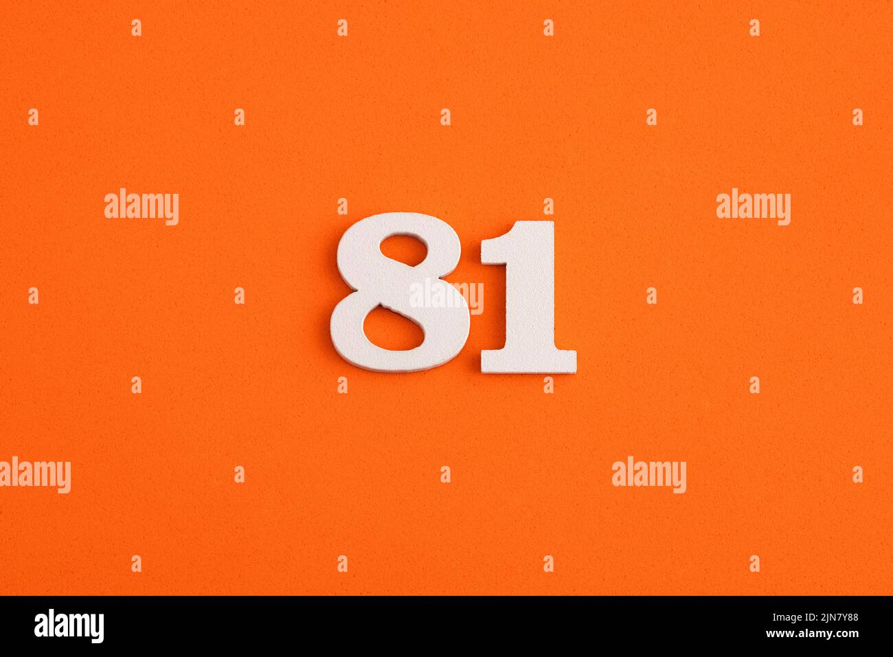 Number 81 - On orange foam rubber background Stock Photo - Alamy