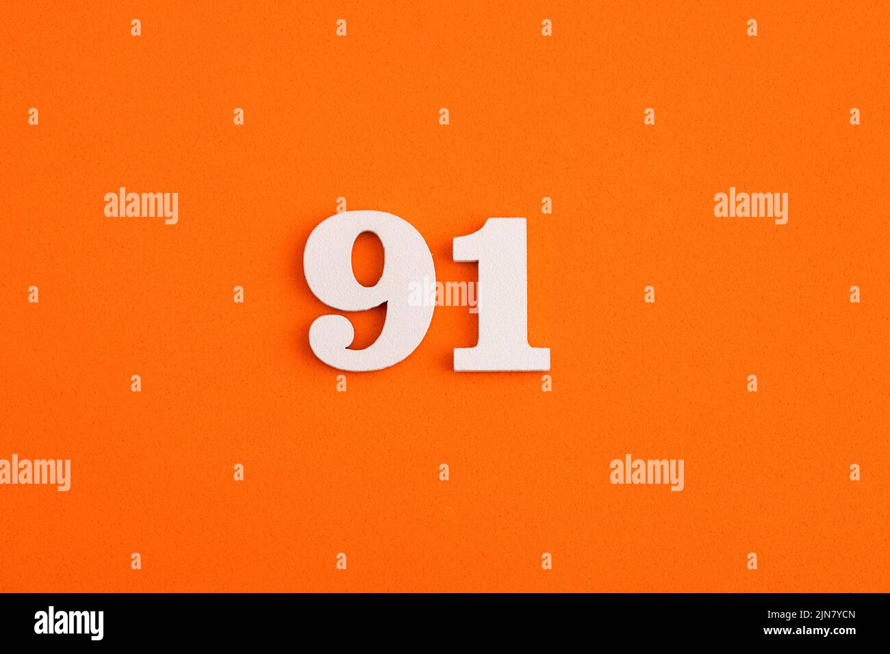 Number 91 - On orange foam rubber background Stock Photo - Alamy