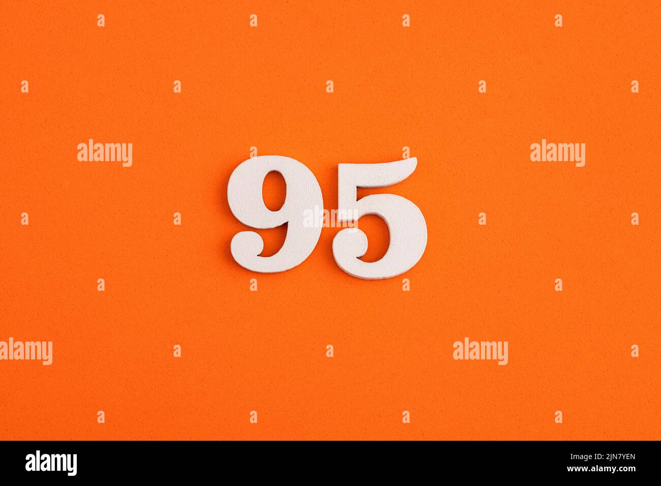 Number 95 - On orange foam rubber background Stock Photo - Alamy