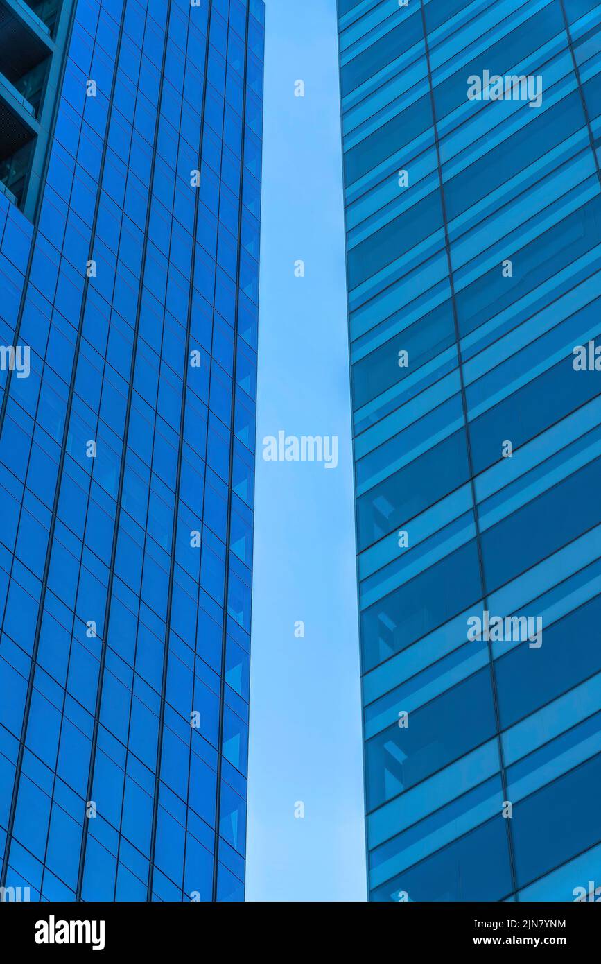 Clear sky in between the two tall buildings with glass walls- Austin ...