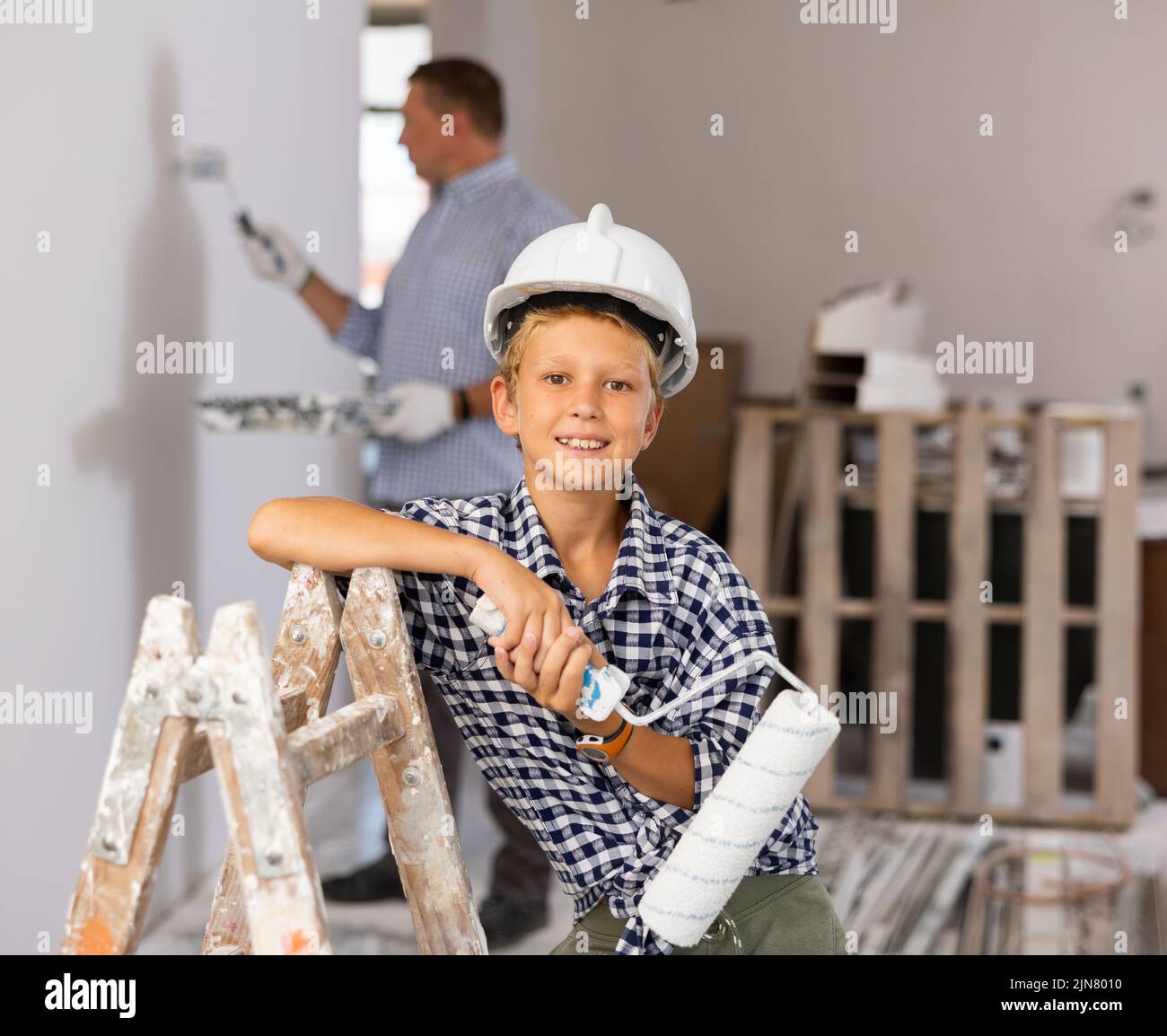 Boy posing with tools for home renovation Stock Photo - Alamy
