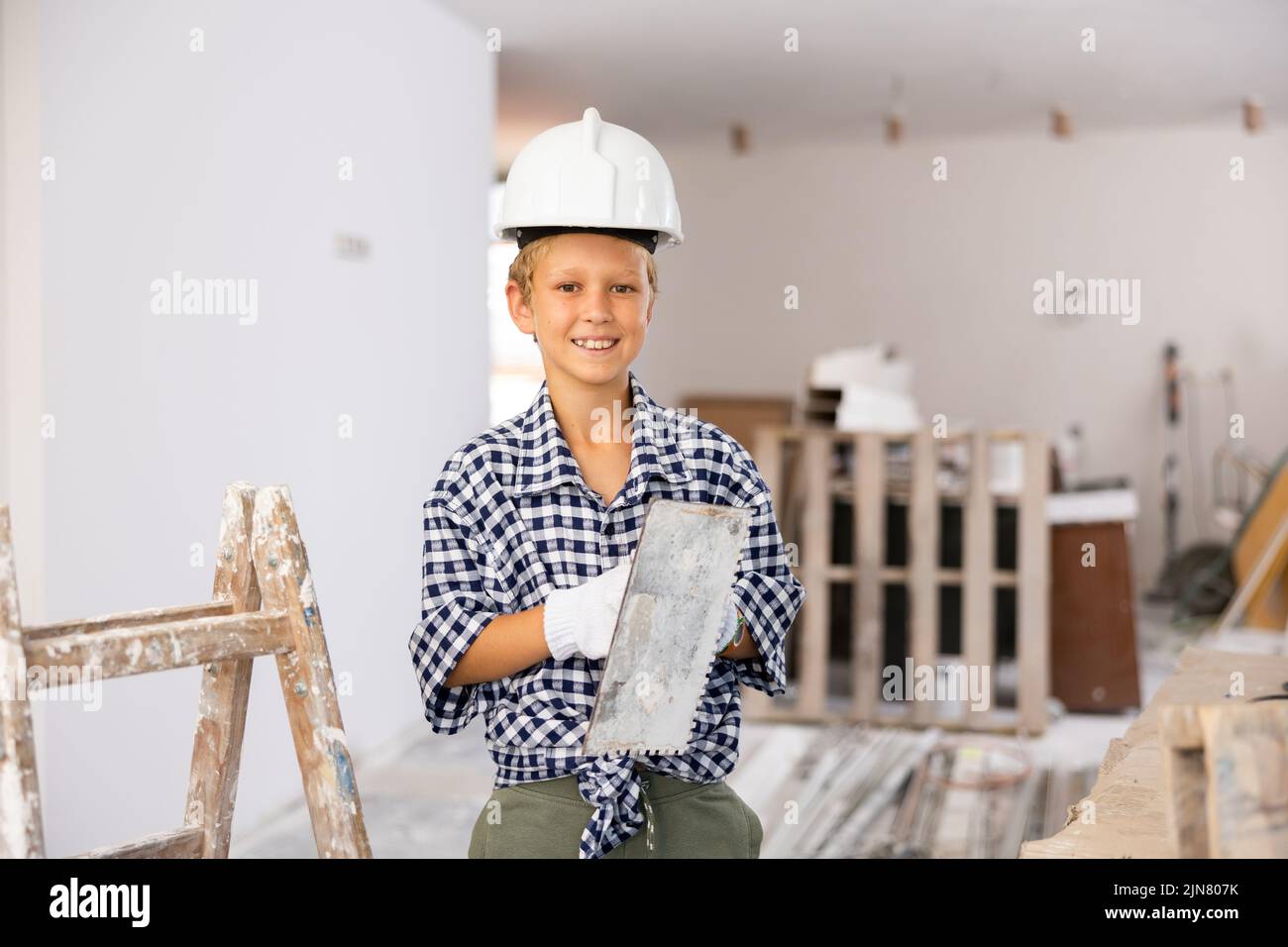 Portrait of young cheerful boy in construction site Stock Photo - Alamy