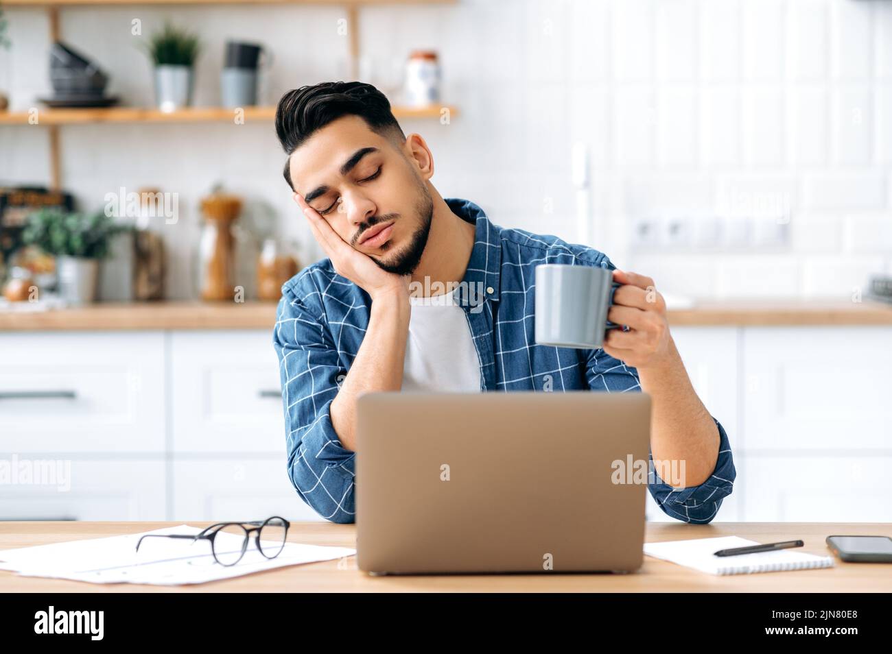 Tired overworked arabian or indian man, student, company ceo, working ...