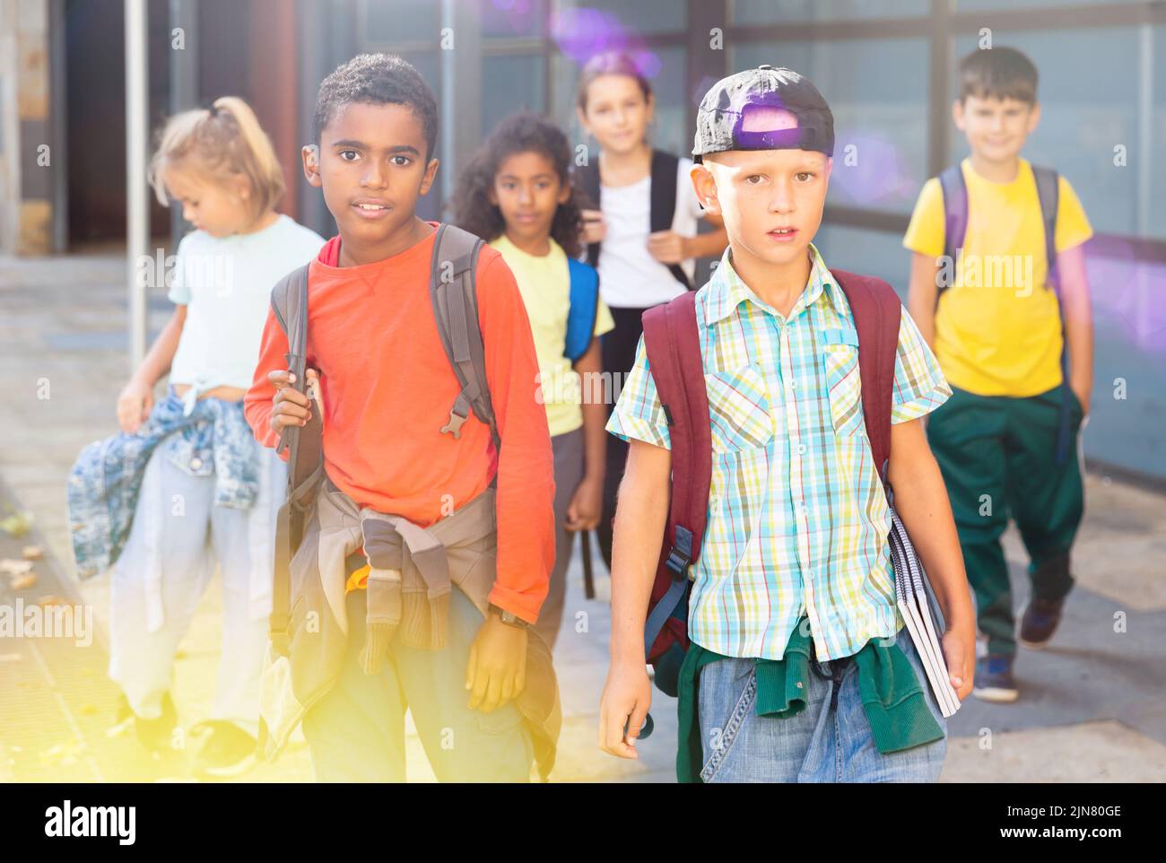 Group of children walking near school Stock Photo - Alamy