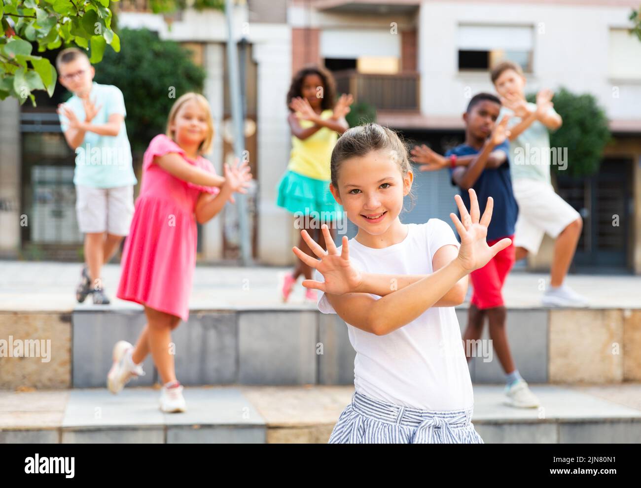 Young boys and girls dancing outdoors Stock Photo - Alamy