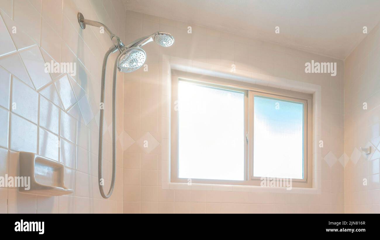 Panorama Sun flare Shower tub with beige tiles surround and wall ...