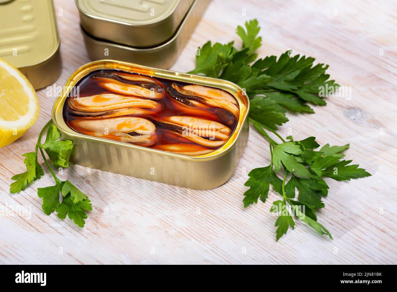 Pickled mussels in oil with parsley, lemon, spices Stock Photo - Alamy