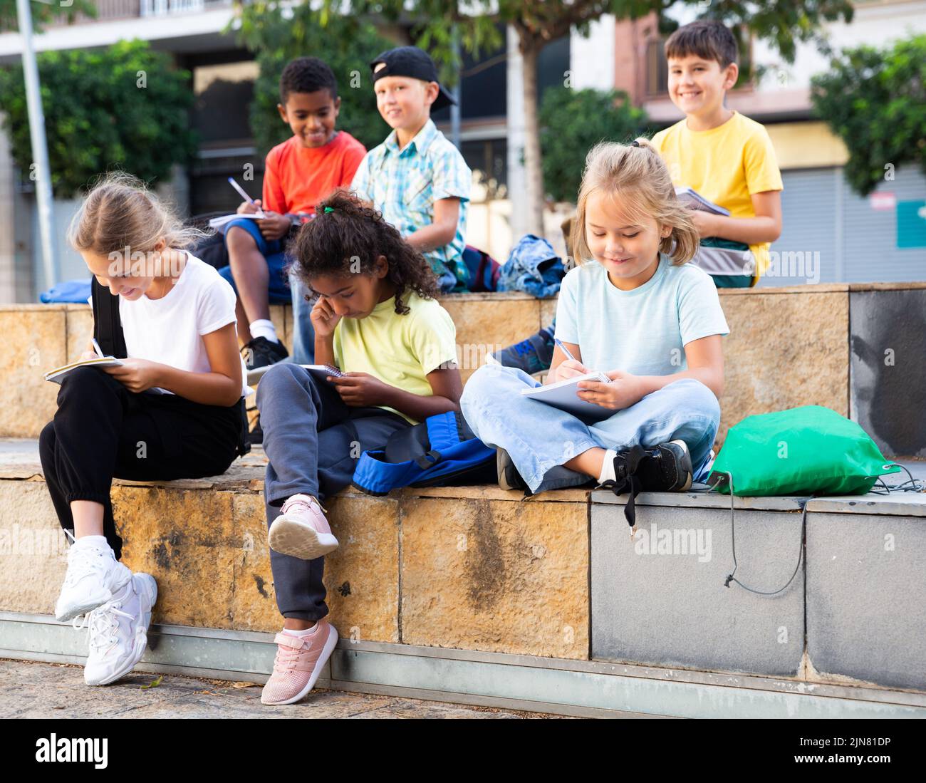 Group of kids having open air lesson Stock Photo - Alamy