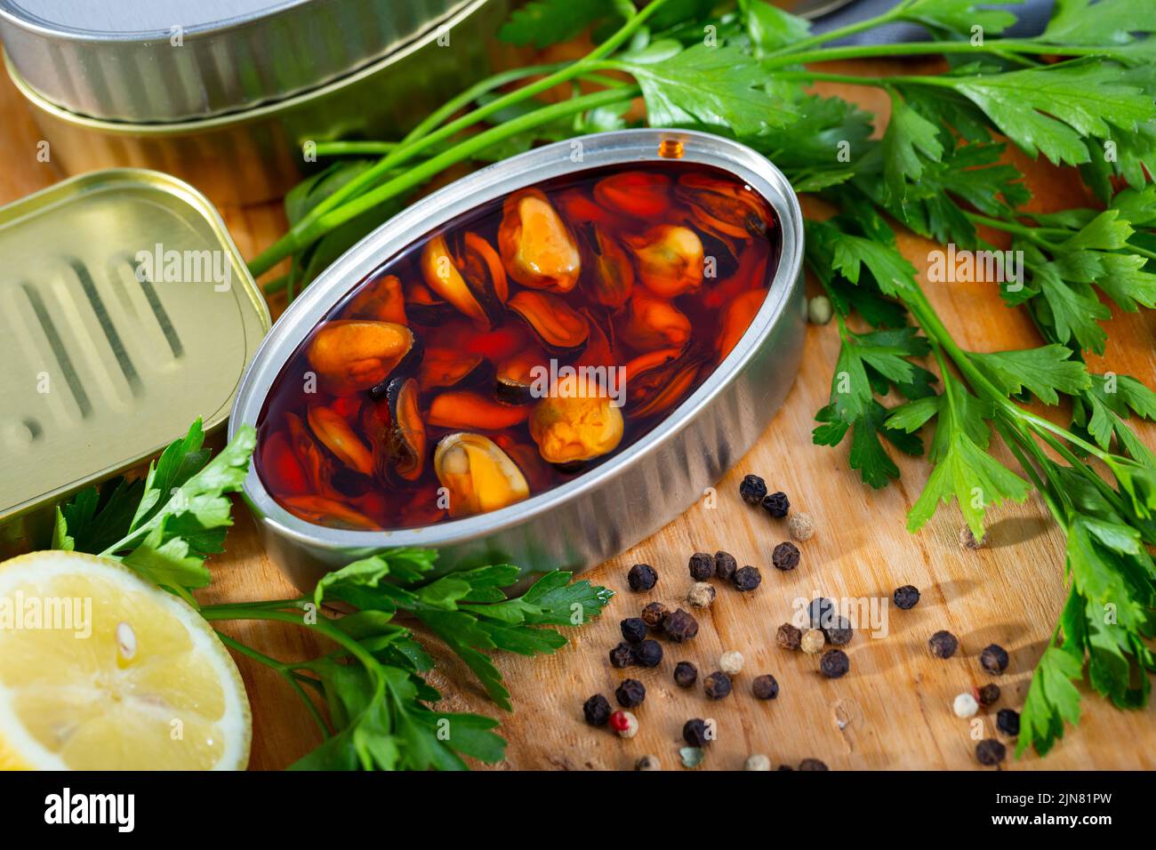 Pickled mussels in oil with parsley, lemon, spices Stock Photo - Alamy