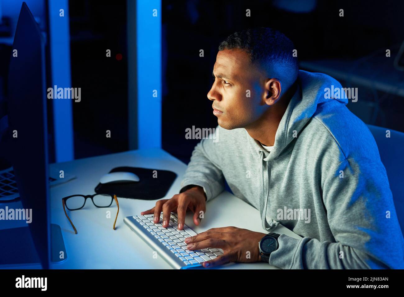 Hes got his eyes on his next victim. a young male hacker cracking a ...