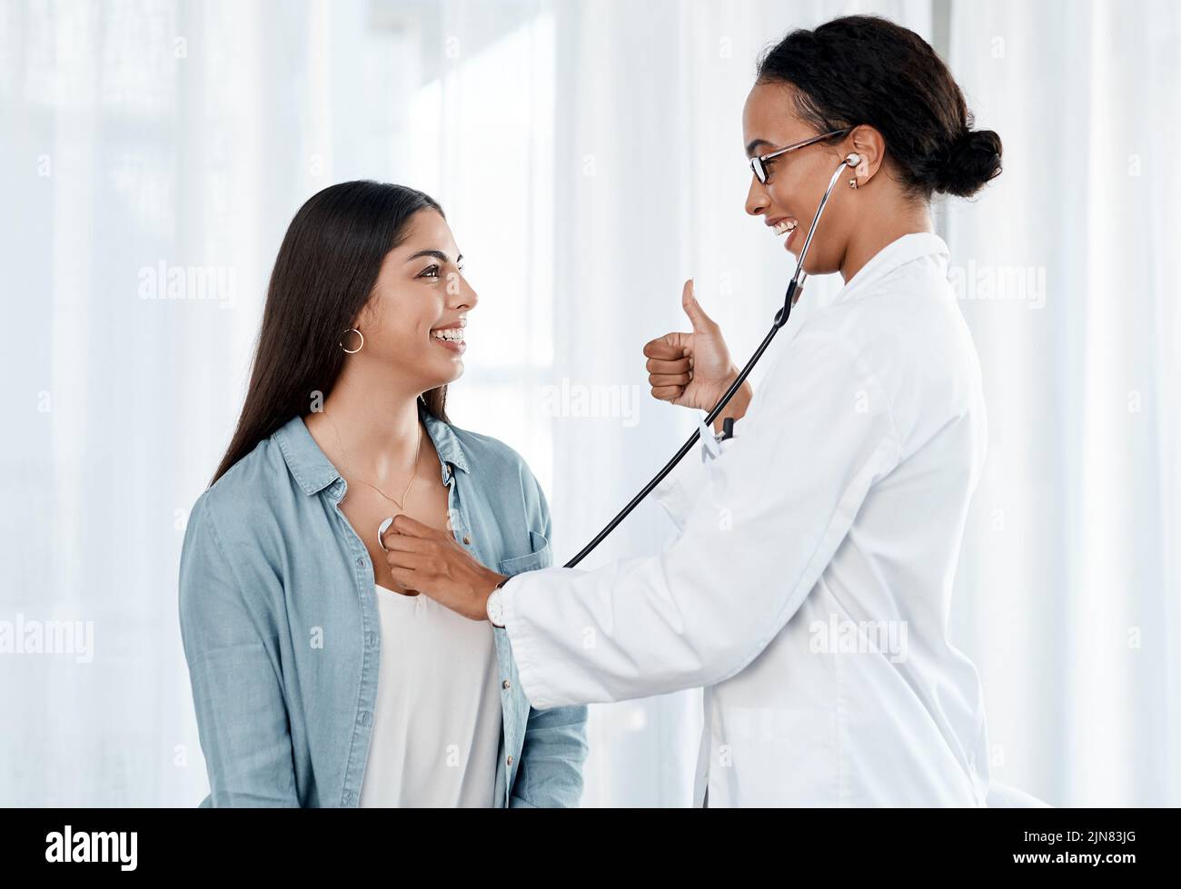 Your infection seems to have cleared up. a doctor giving a patient the ...