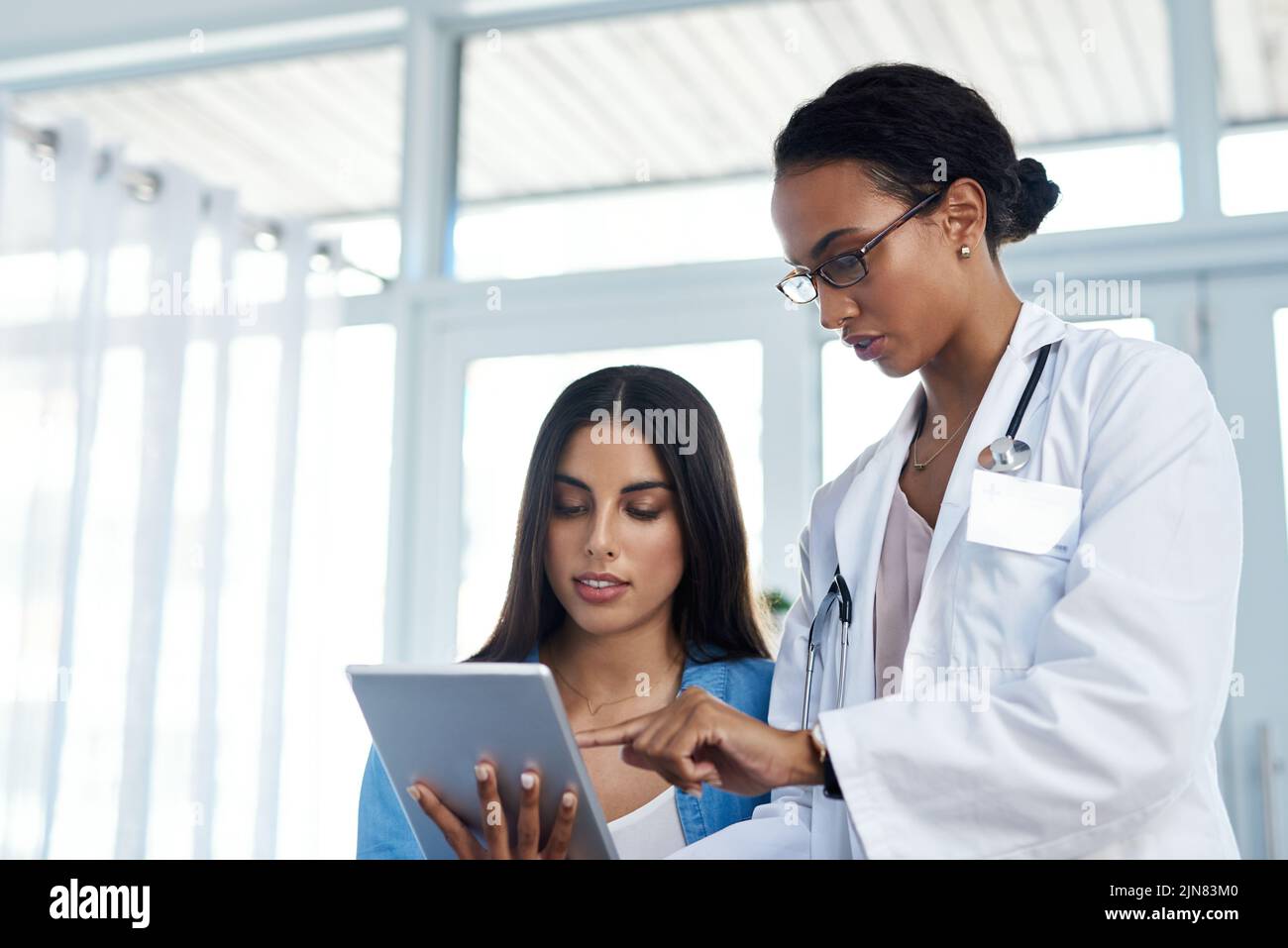 Lets run through some treatment options for you. a young doctor using a ...