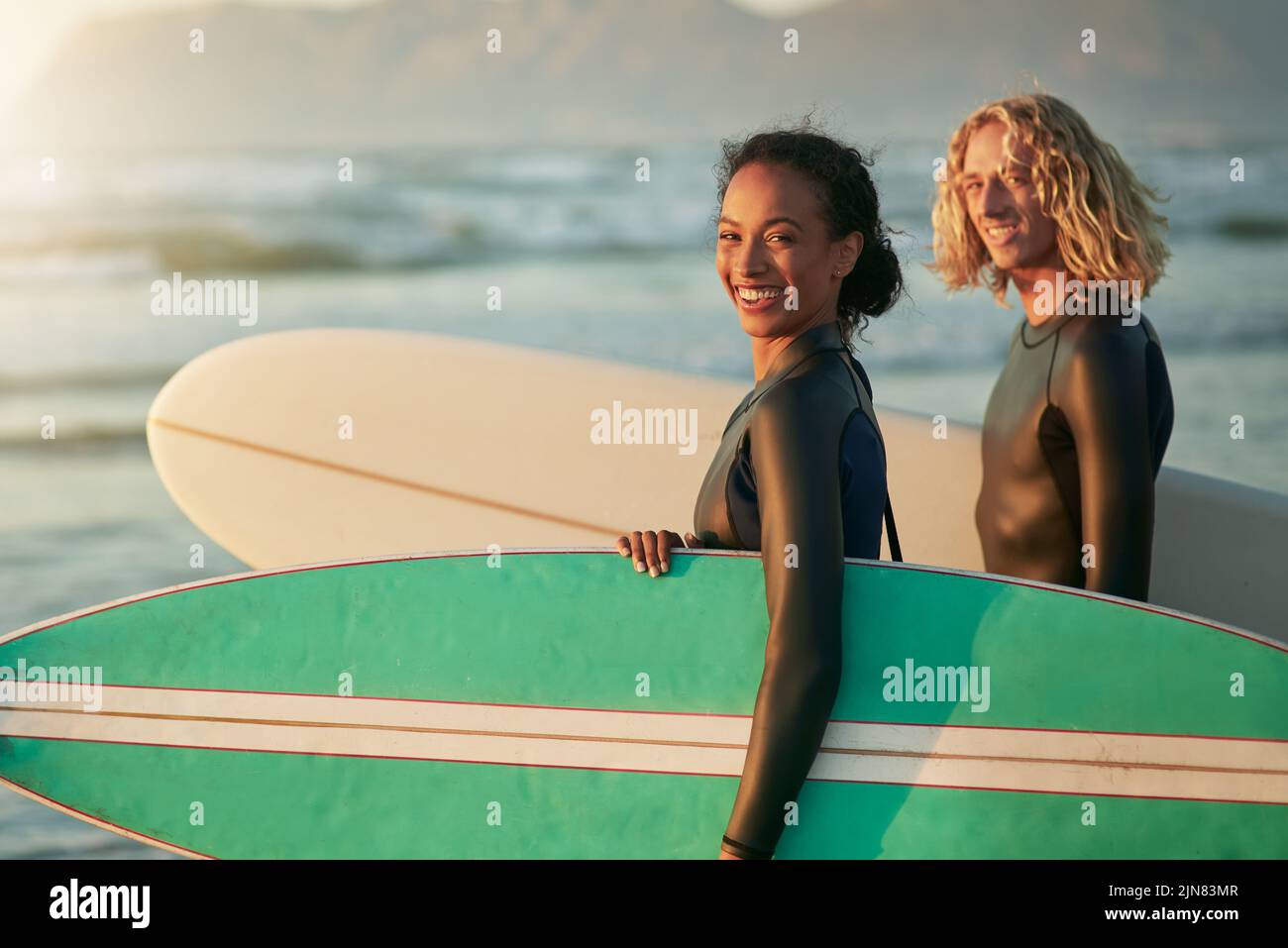 Were always having fun together. a cheerful young couple going surfing ...