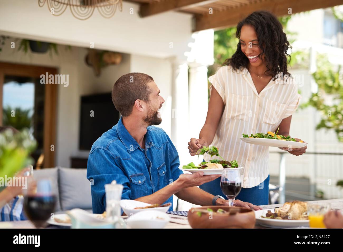 She serves every meal with a smile on her face. a beautiful young woman ...