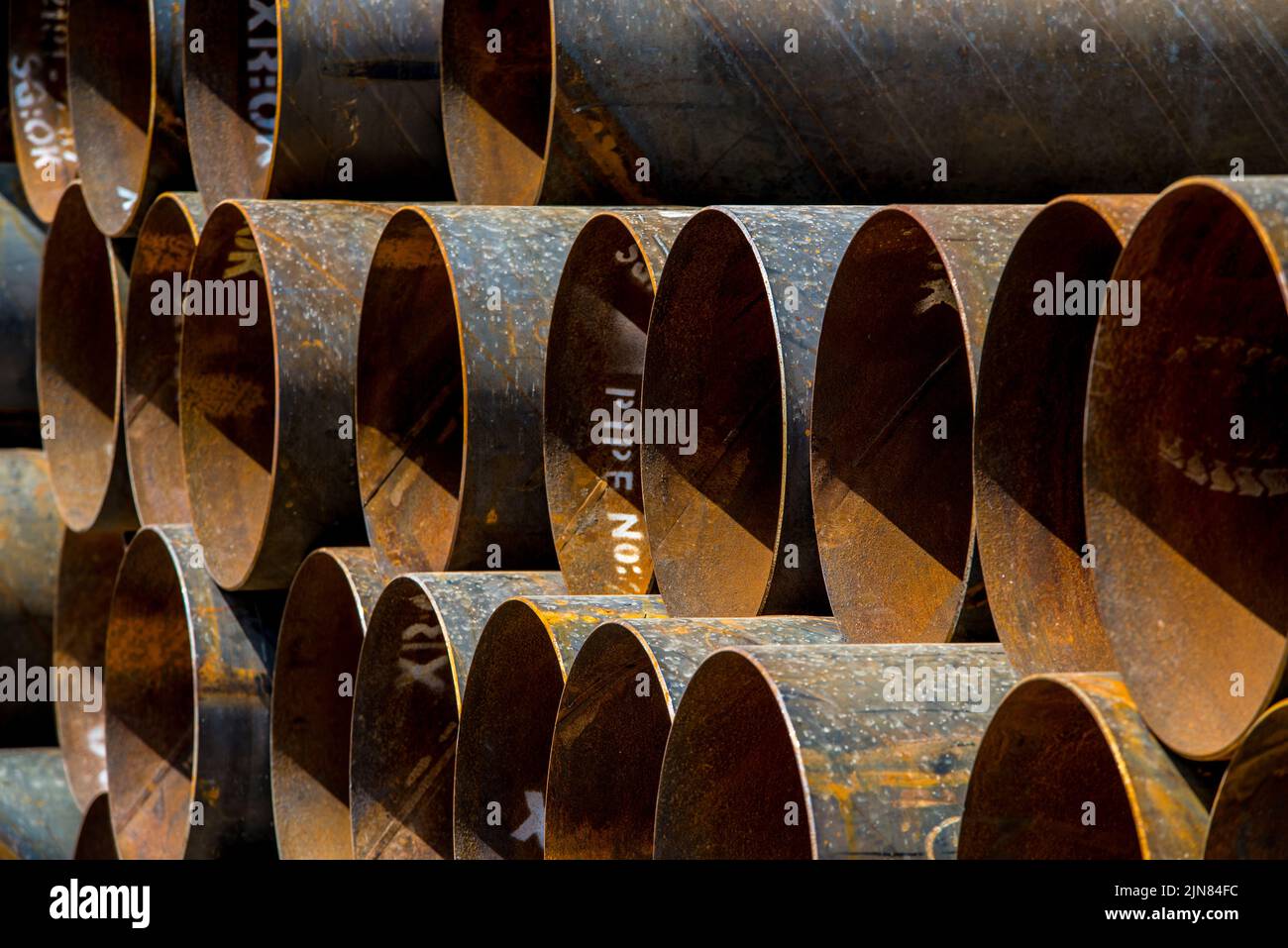 Stack of large diameter metal pipes Stock Photo - Alamy
