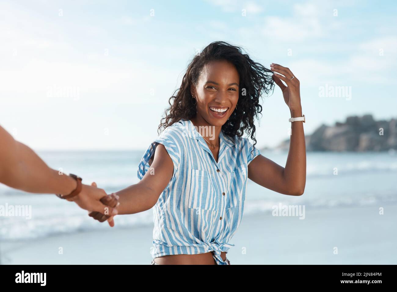 Im so ready for some summer fun. POV shot of a young woman holding her ...