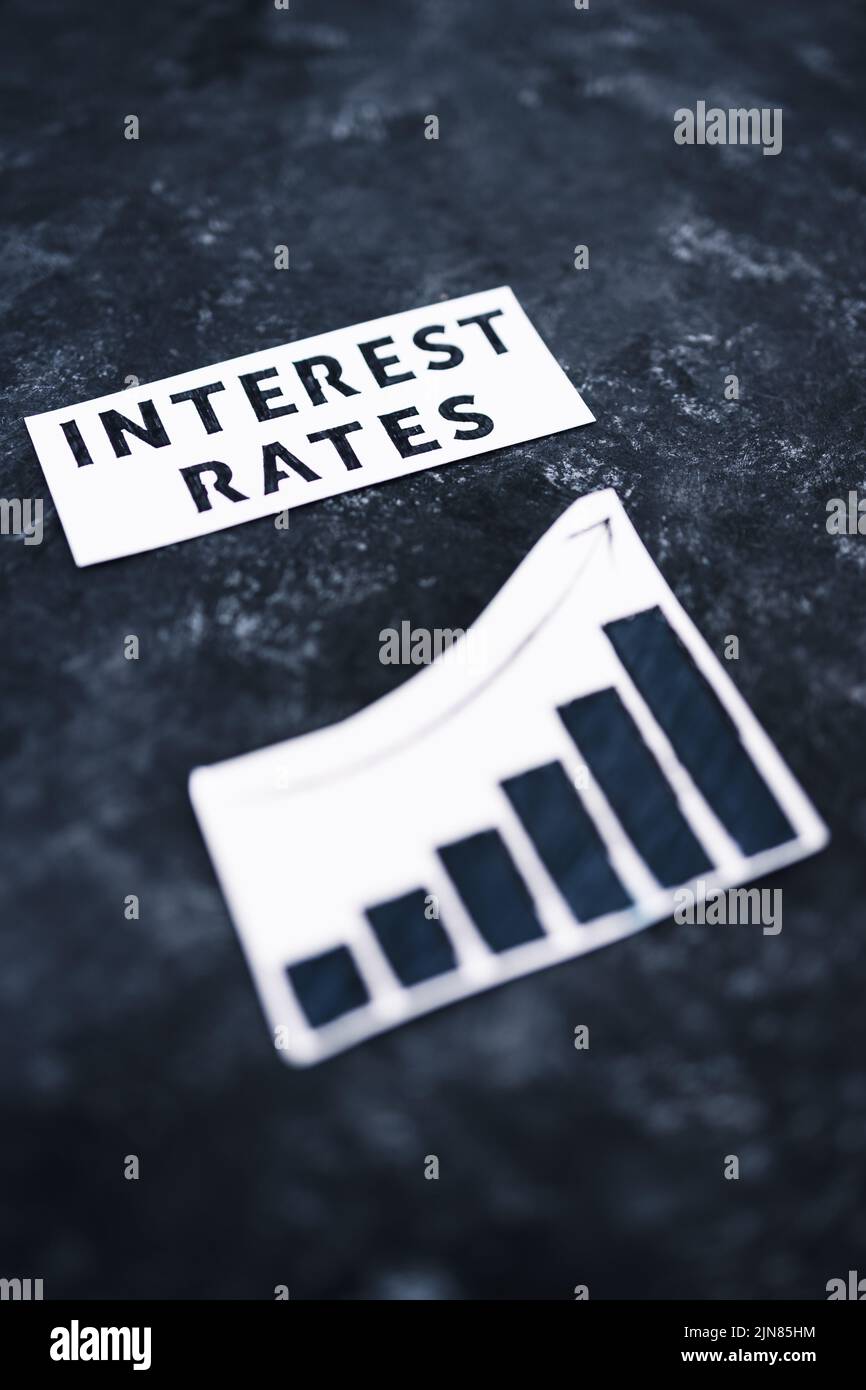 interest rates text and graph showing stats going up, concept of the ...