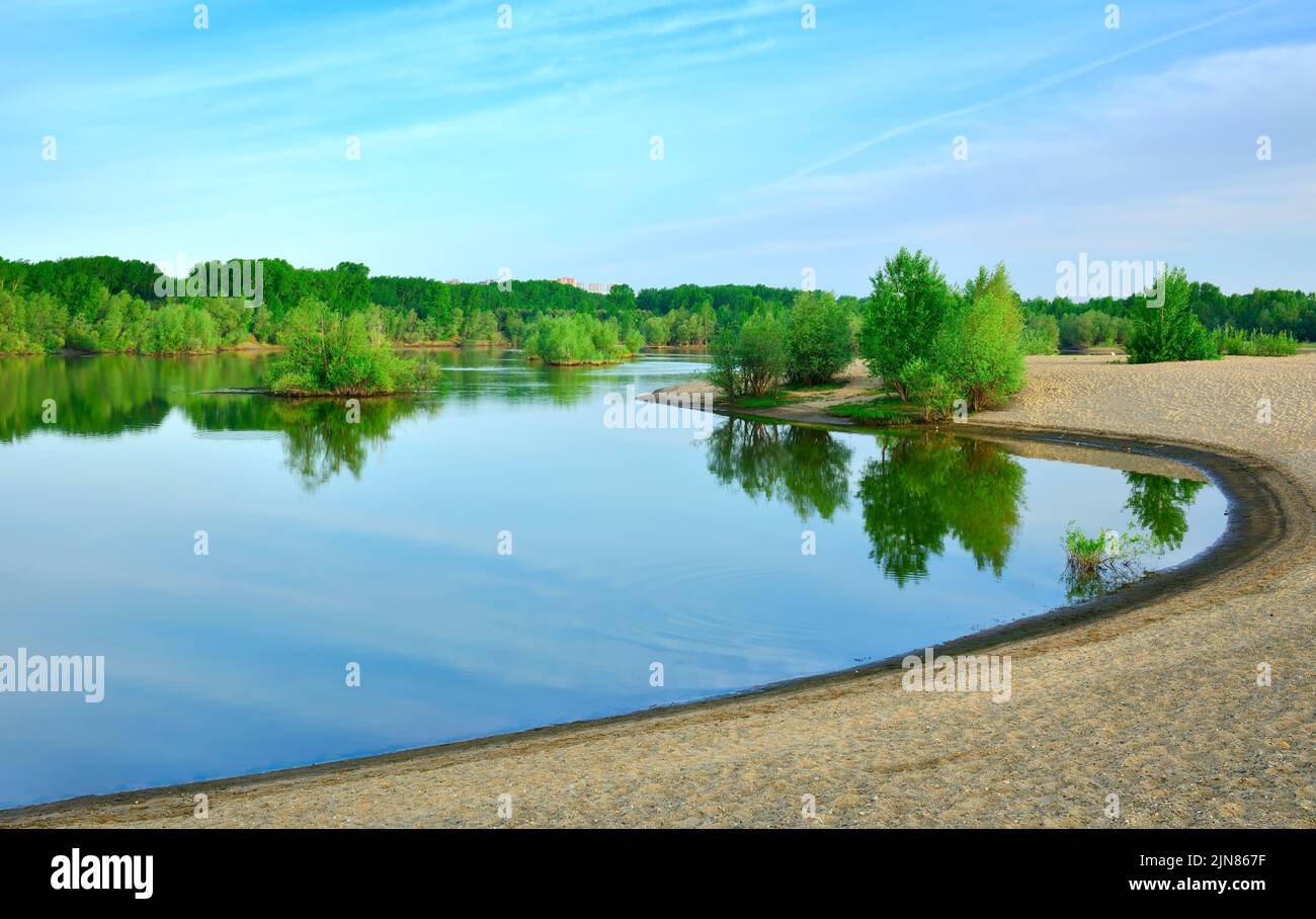 Sand spit on the Ob river. A deserted beach in the morning on the ...