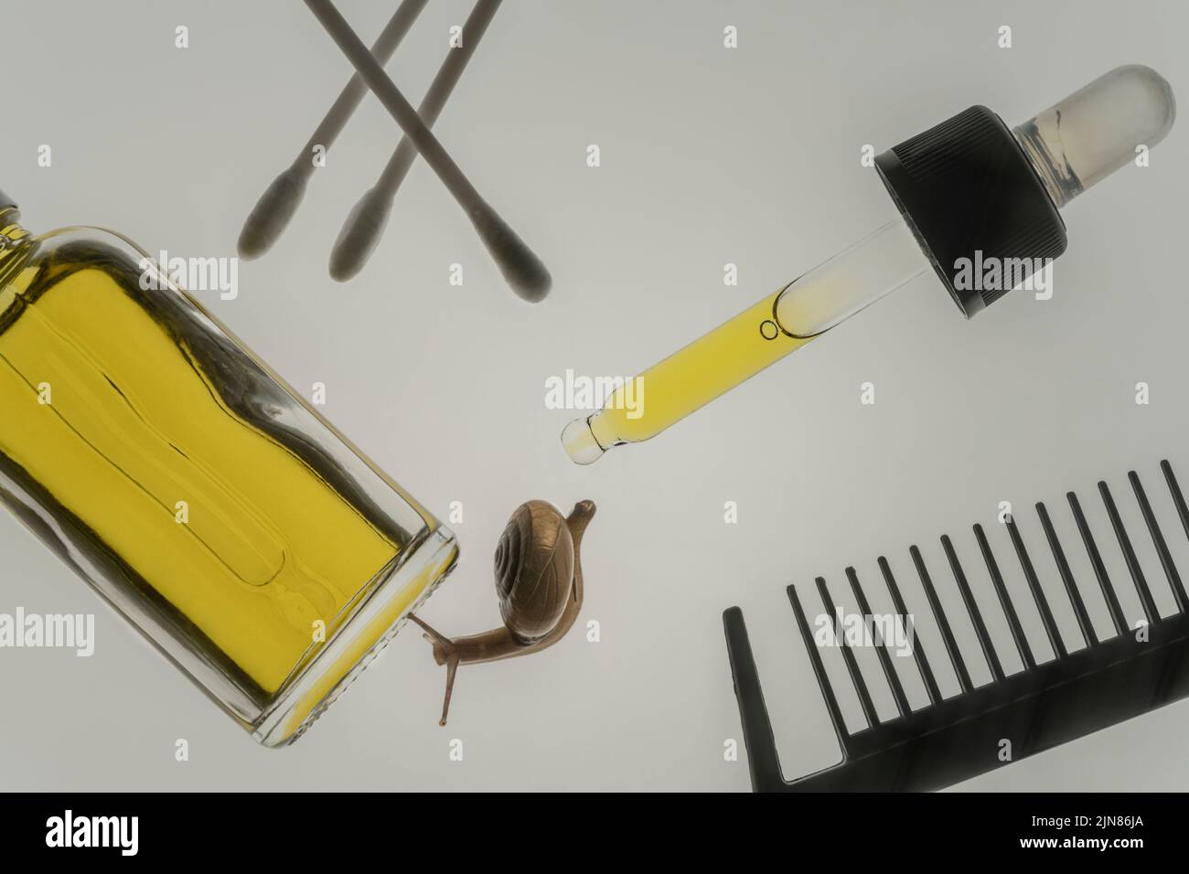 Liquid serum in a bottle with a dropper. Hair skin care concept with ...