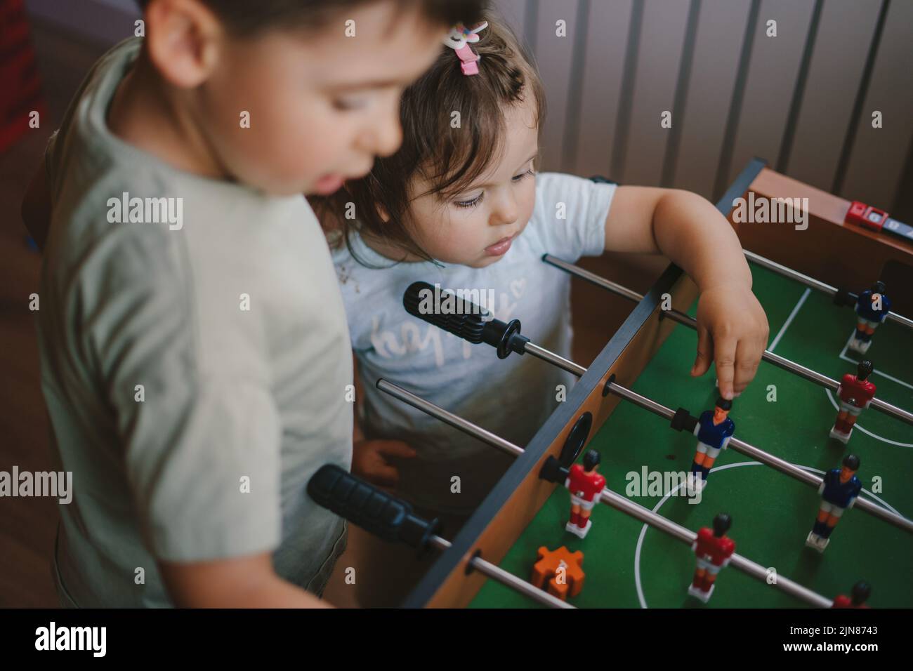 Family kids play soccer together hi-res stock photography and images ...
