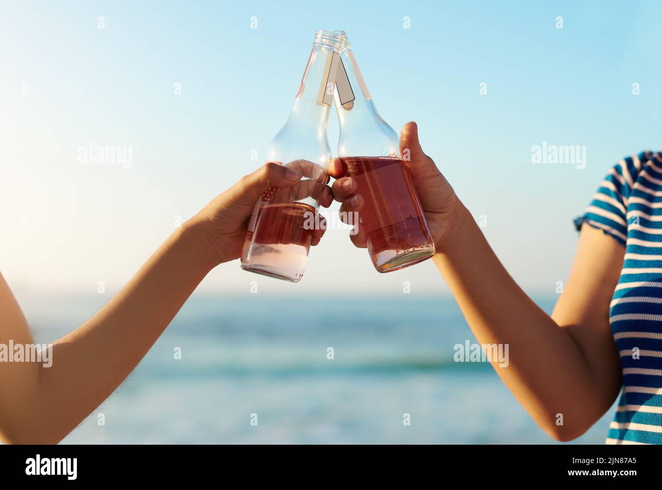 Cheers to great friendships. two unrecognizable young women celebrating ...