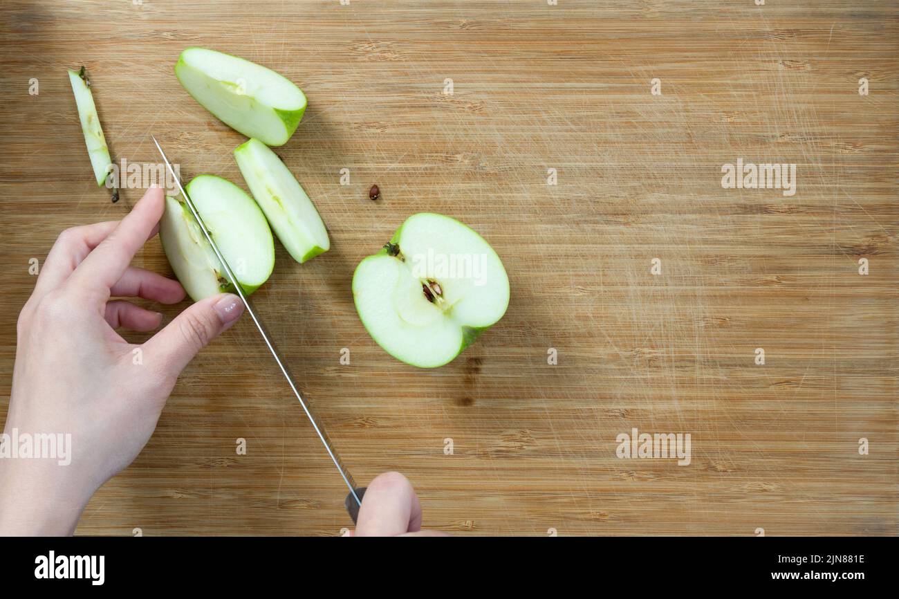 Woman knife cutting apple on hi-res stock photography and images - Alamy