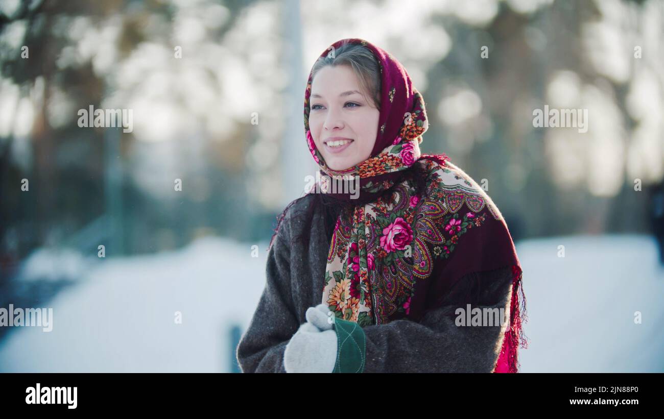 Russian folklore - russian woman in a scarf is clapping her hands and ...