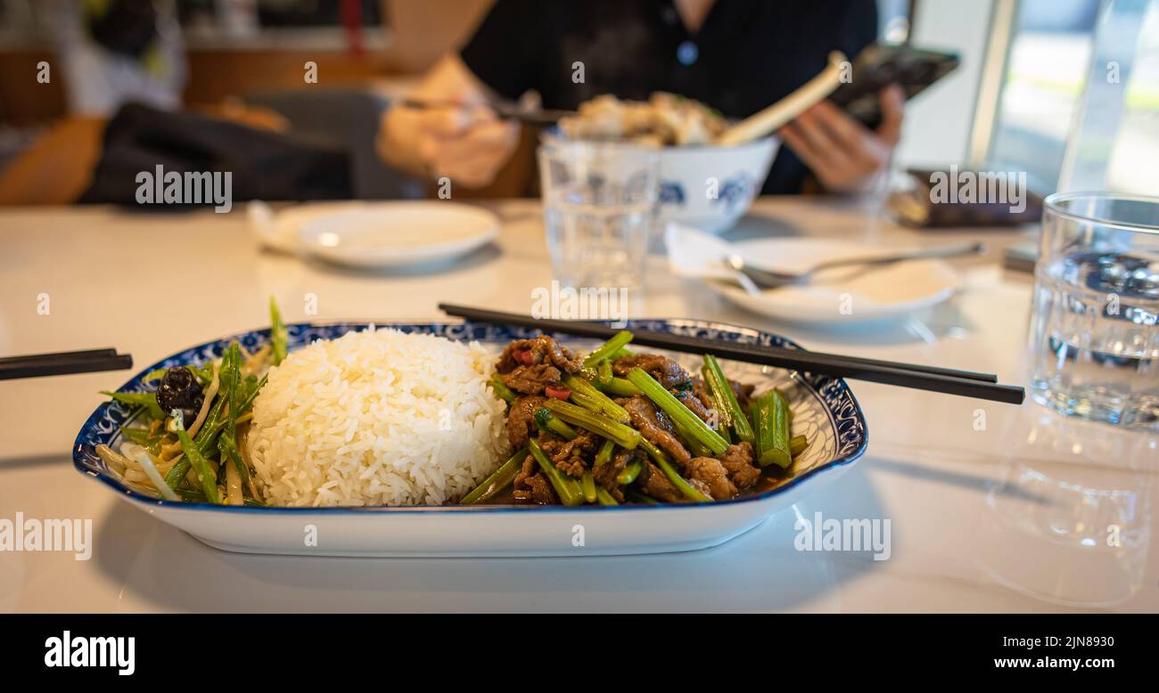 Asian food in a plate with rice. Various of asian meals at the ...