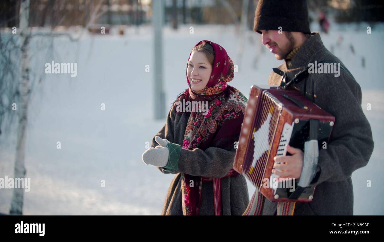 Russian folklore - russian man playing accordion outdoors and smiling ...