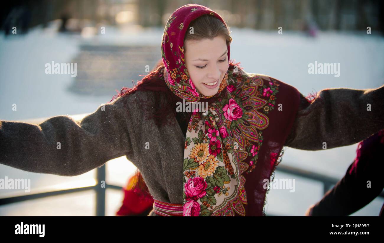 Russian folklore - young pretty woman dancing outdoors at winter Stock ...