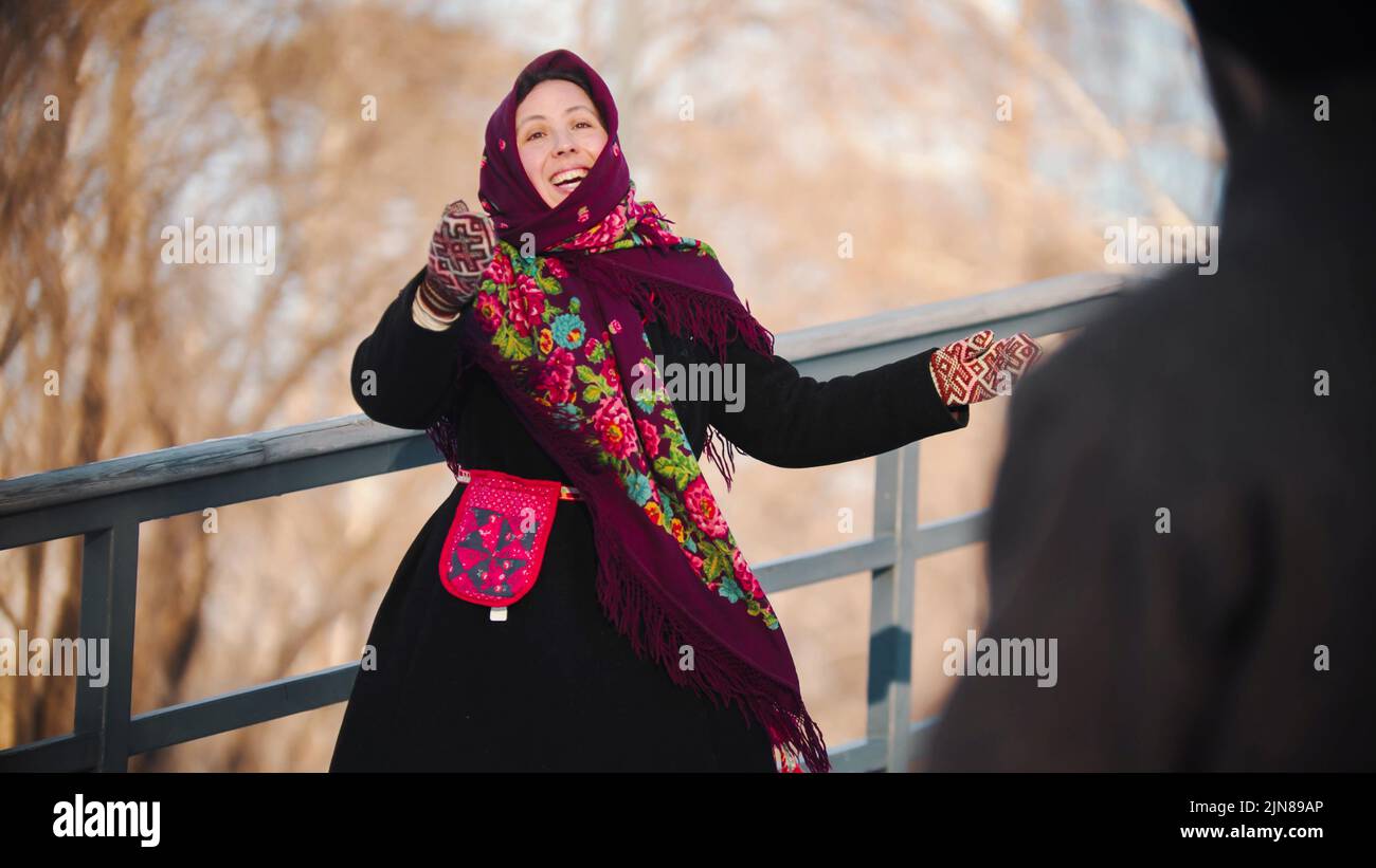 Russian folklore - cheerful woman in a beautiful scarf is dancing in ...