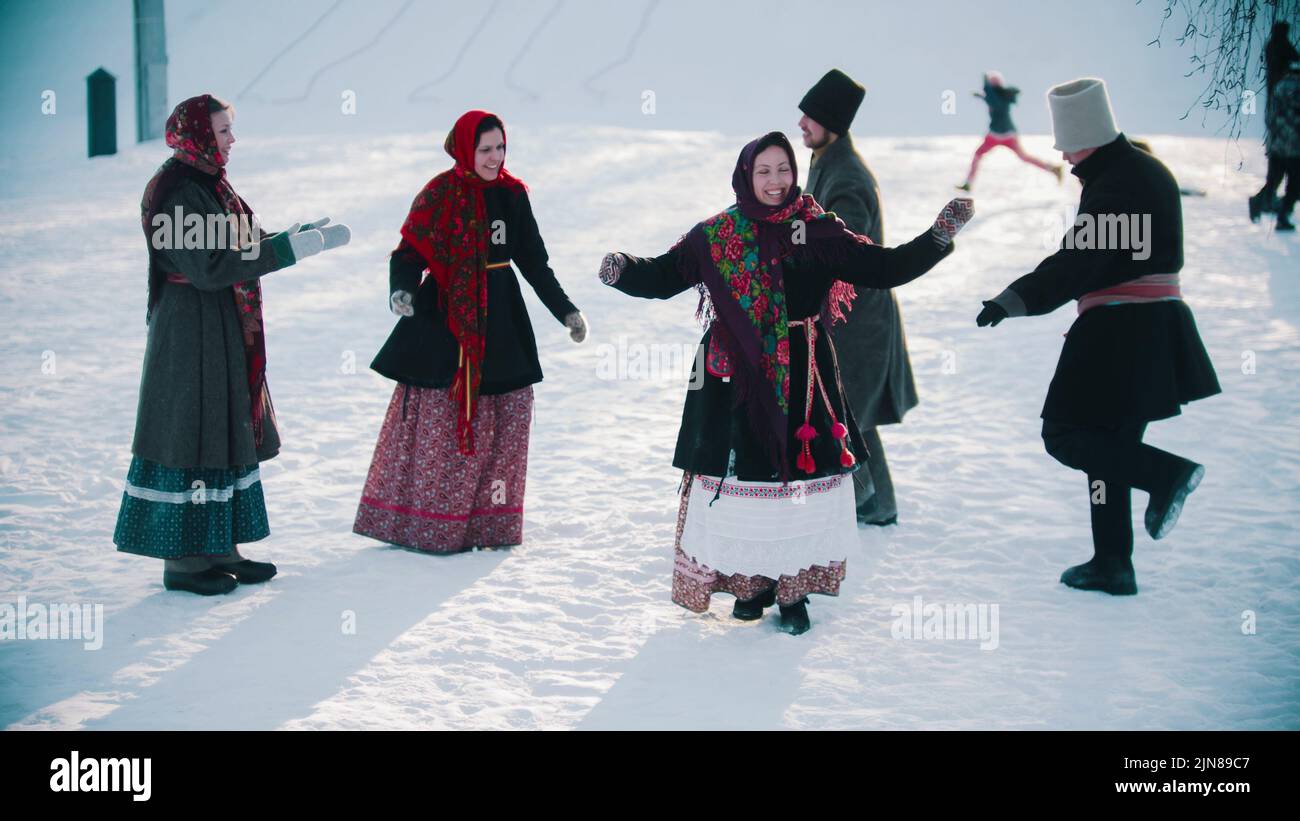 Russian folk - young people in felt boots dancing outdoors Stock Photo ...