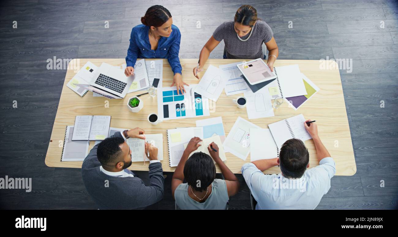 Handling business the best way we know how. High angle shot of a group ...